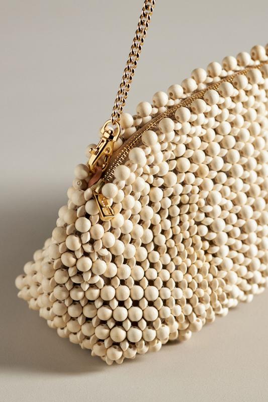 Aranaz 하프 문 클러치 앤트로폴로지 한국 공식 스토어 유니크한 여성 패션 및 라이프스타일 편집샵 200개이상의 프리미엄 브랜드 여성 의류 액세서리 홈