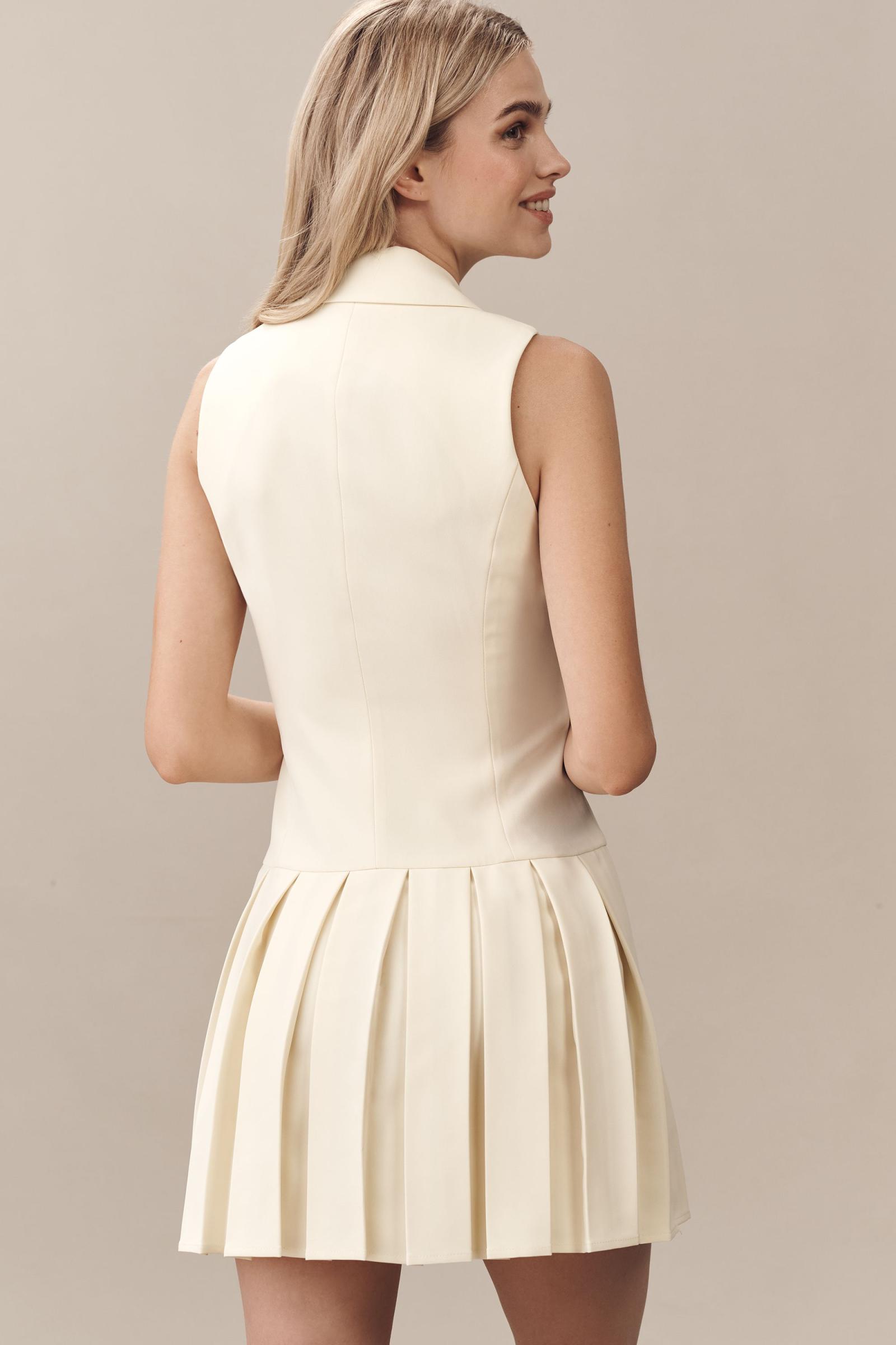 엑스트로앤버트 엘리자 슬리브리스 테일러드 플리츠 미니 드레스 앤트로폴로지 한국 공식 스토어 유니크한 여성 패션 및 라이프스타일 편집샵 200개이상의 프리미엄 브랜드